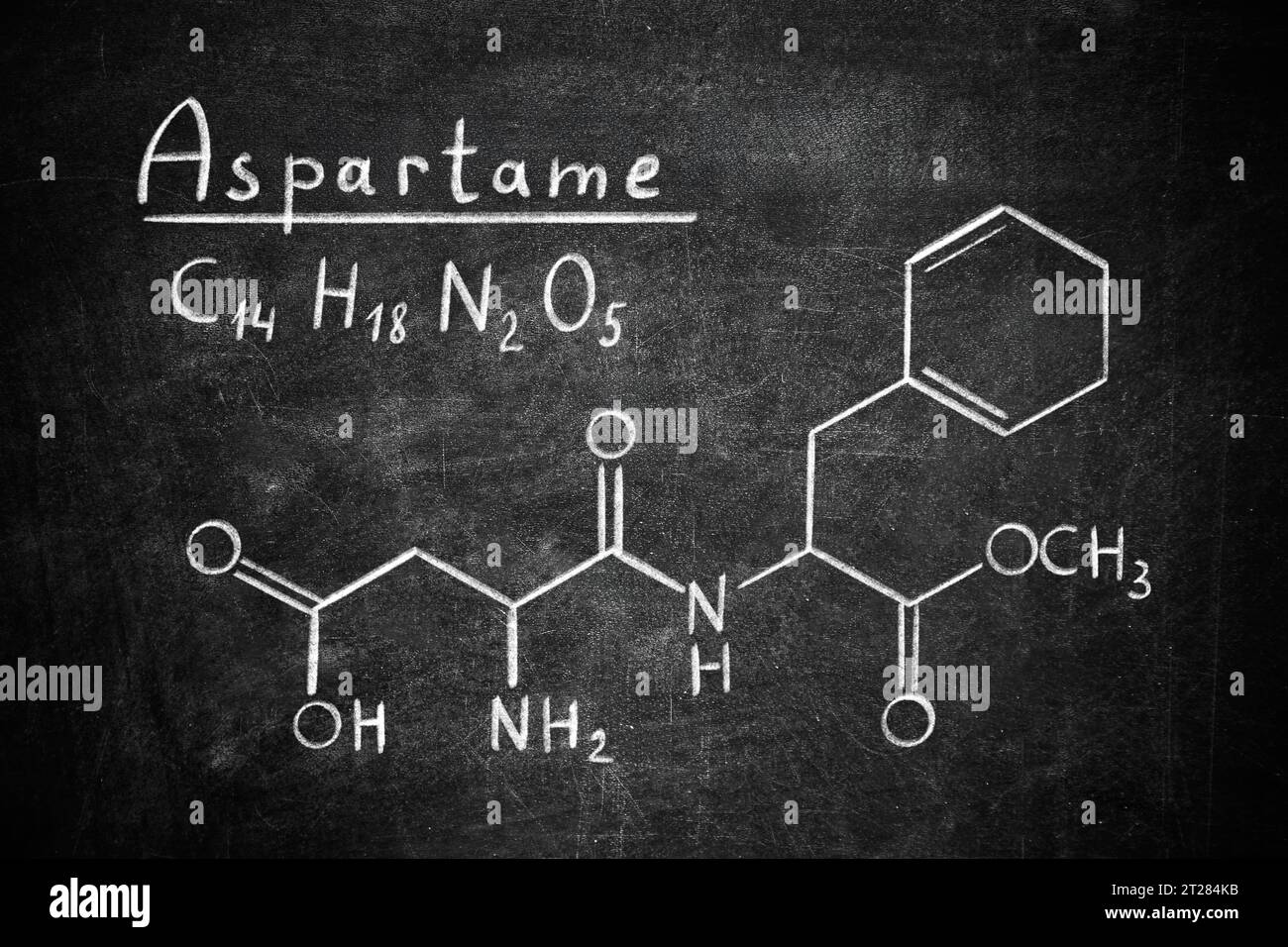 Formula of aspartame (chemical and structural) written on blackboard ...
