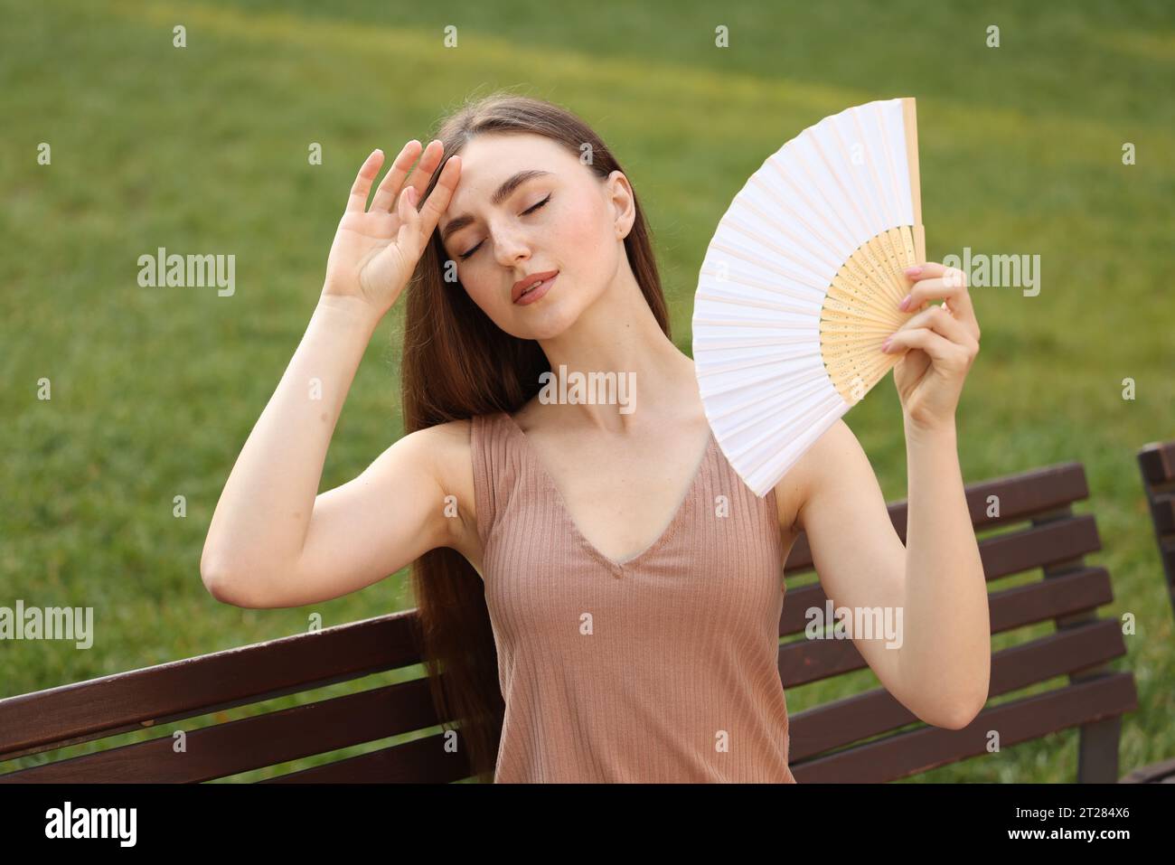 Hand fan heat hi-res stock photography and images - Alamy