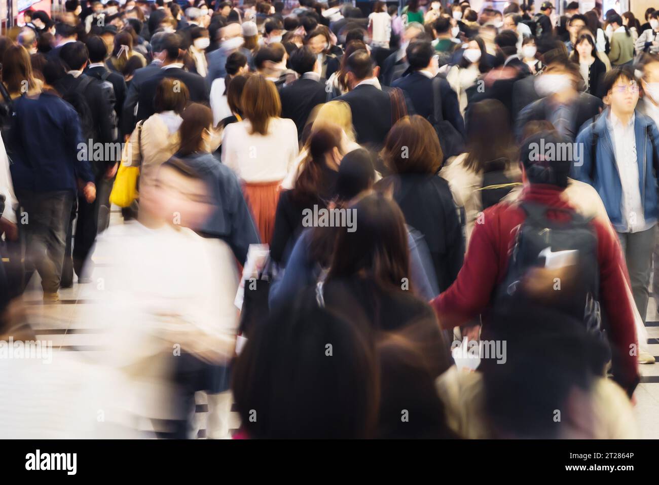 picture of a crowd of people walking in a subway underpass in Tokyo ...