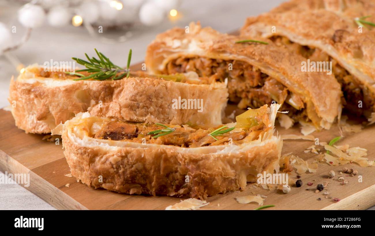 Puff pastry vegetable roll on kitchen decorated countertop Stock Photo ...