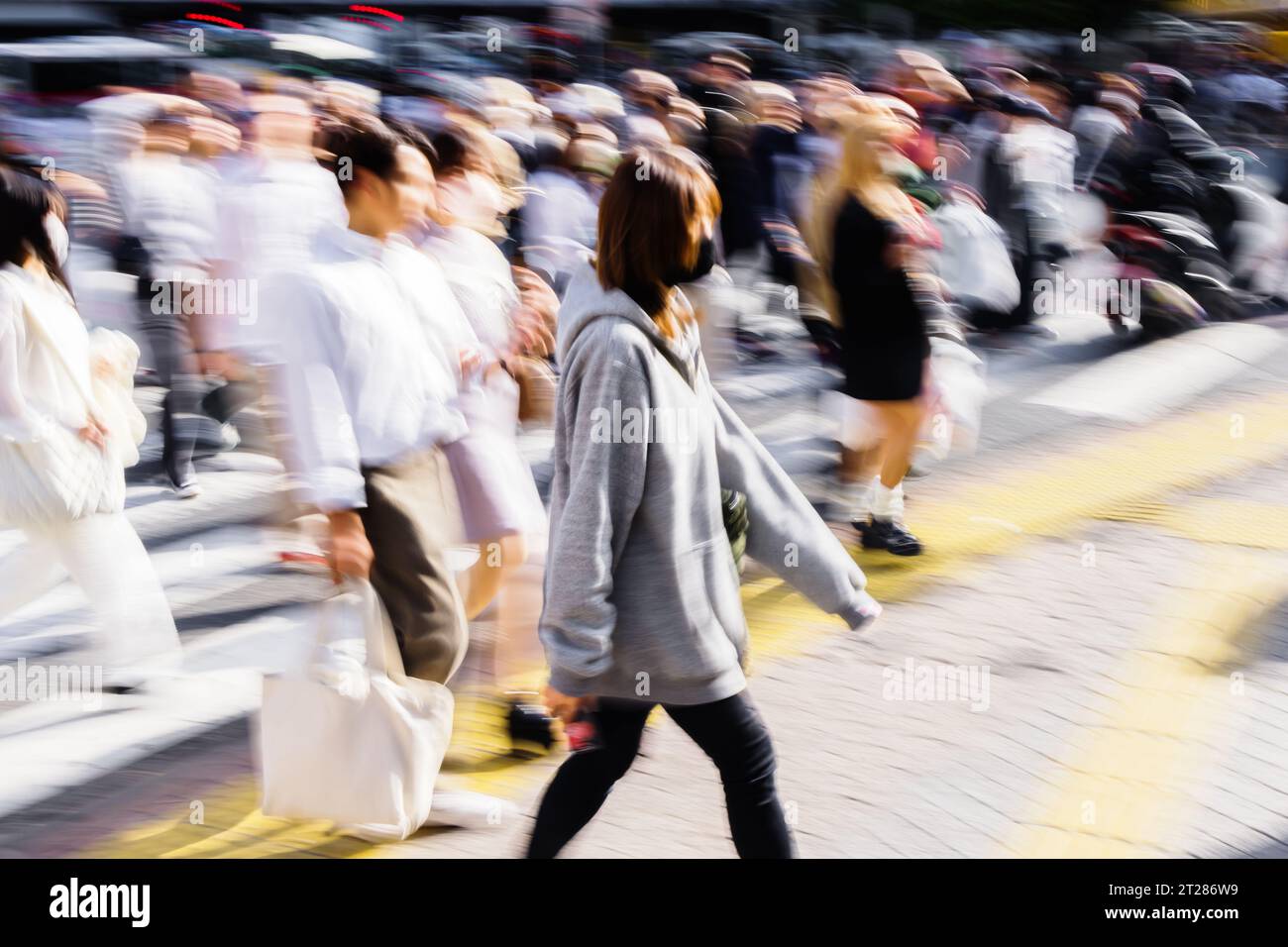 picture with intentional motion blur effect of crowds of people ...