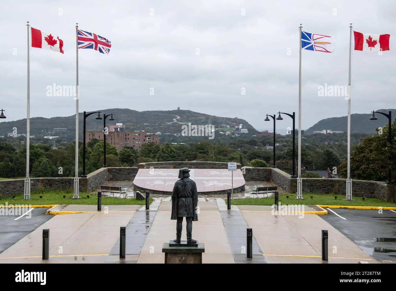 Flags and statue of John Cabot in the parking lot of the provincial ...