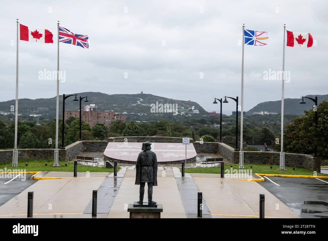 Flags and statue of John Cabot in the parking lot of the provincial ...