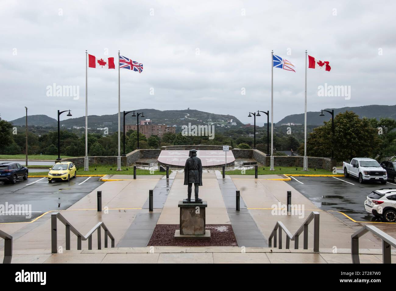 Flags and statue of John Cabot in the parking lot of the provincial ...