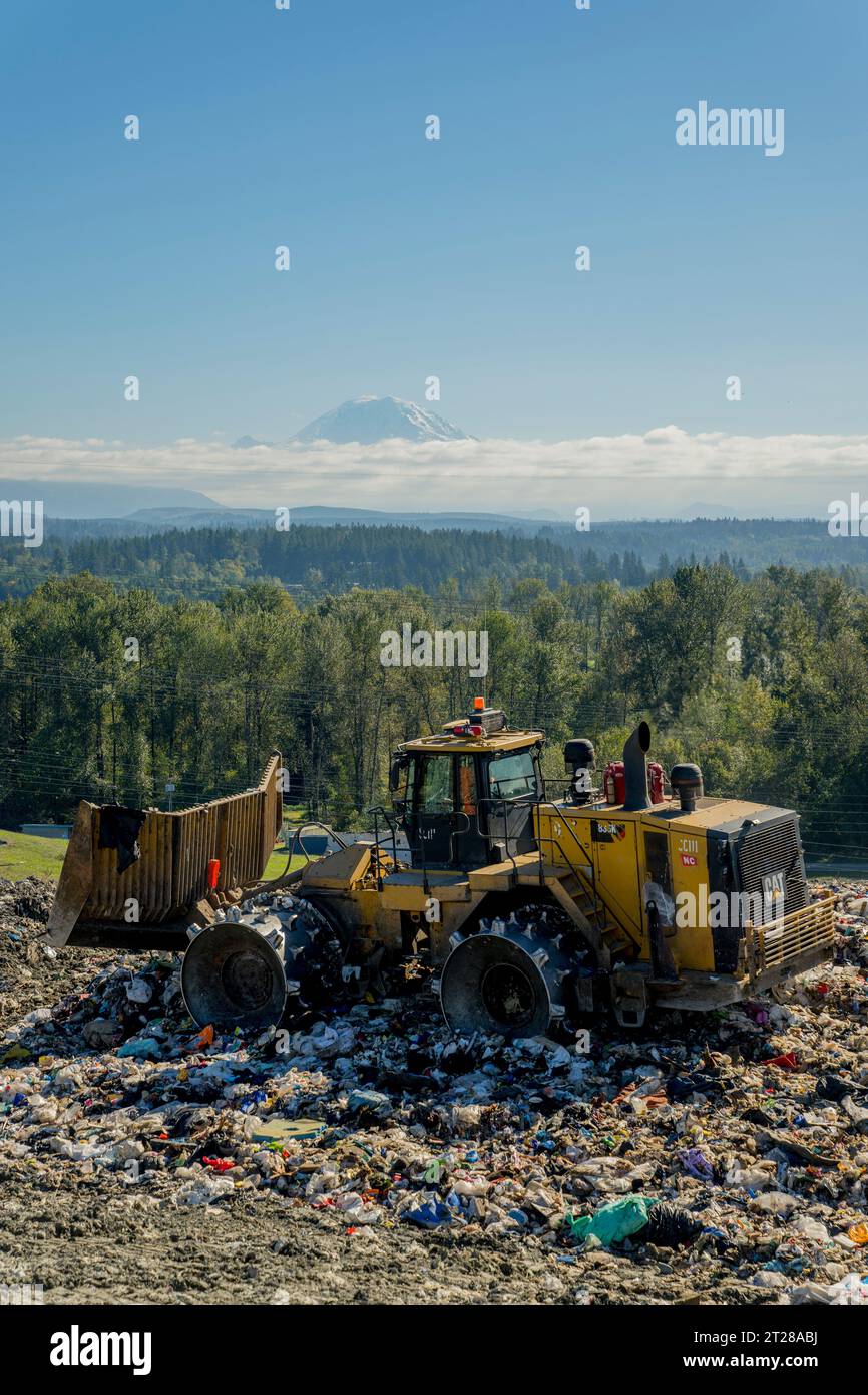 Heavy machinery is spreading the garbage at the King County Cedar Hills ...