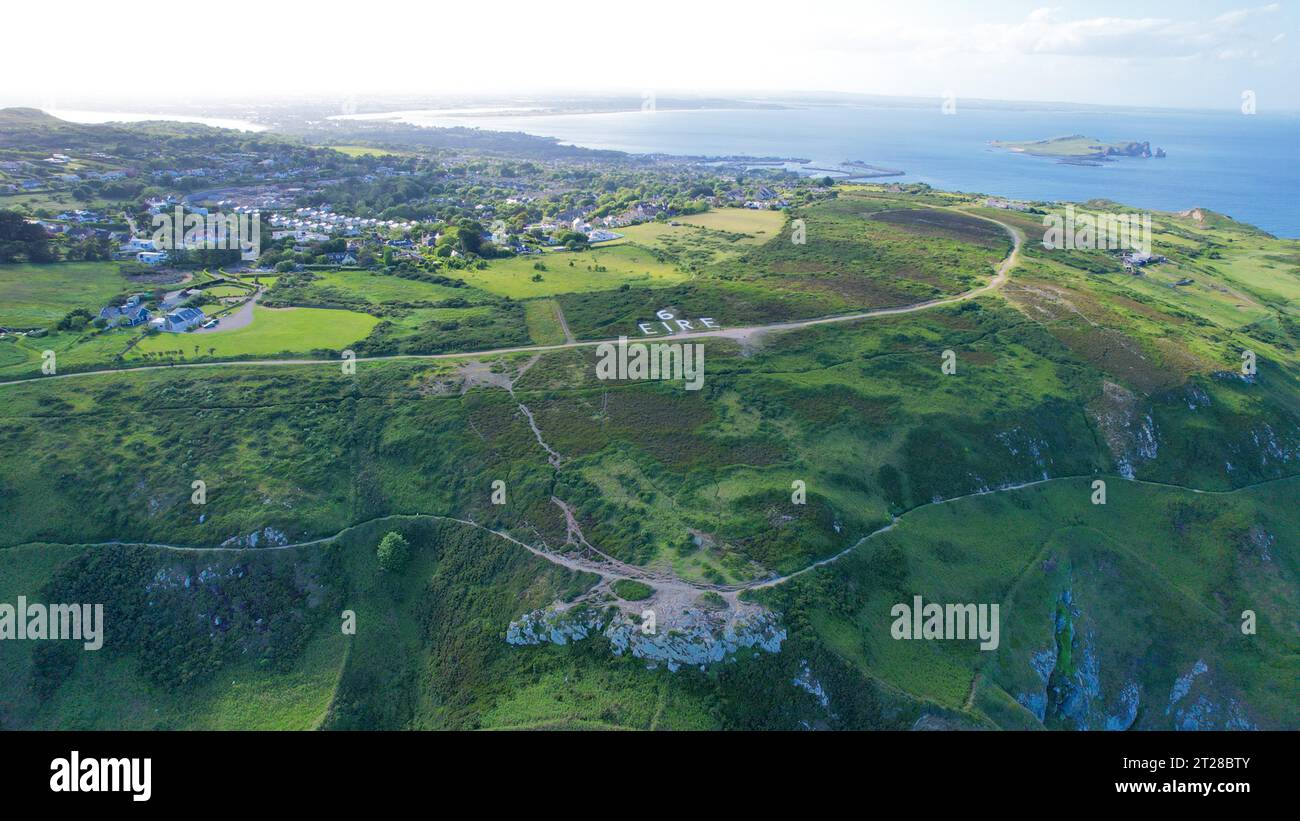 An Aerial view of a vibrant green hillside with lush greenery Eire 6 ...