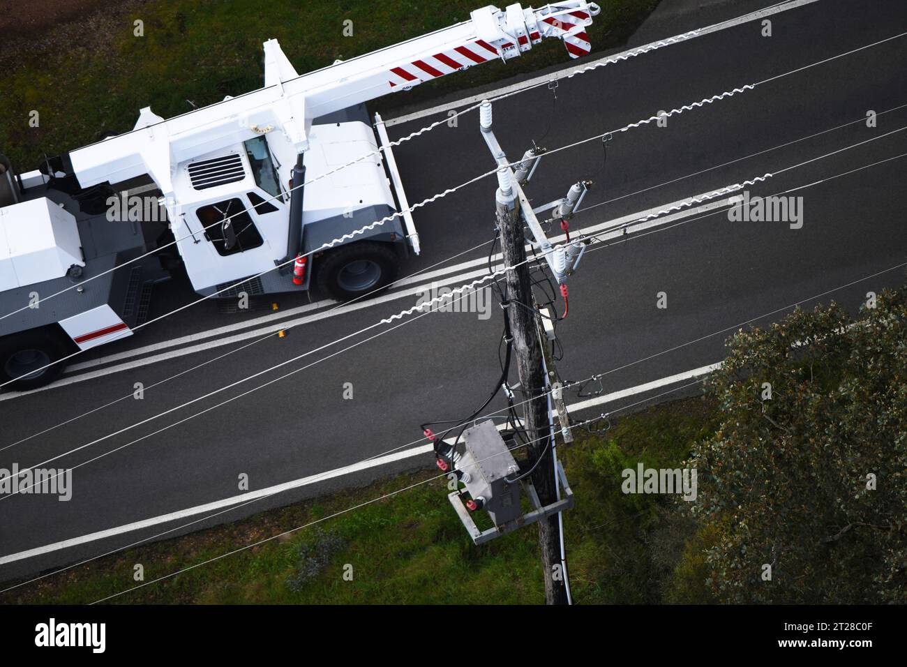 Aerial view of maintenance crane next to a telephone pole, highlighting ...