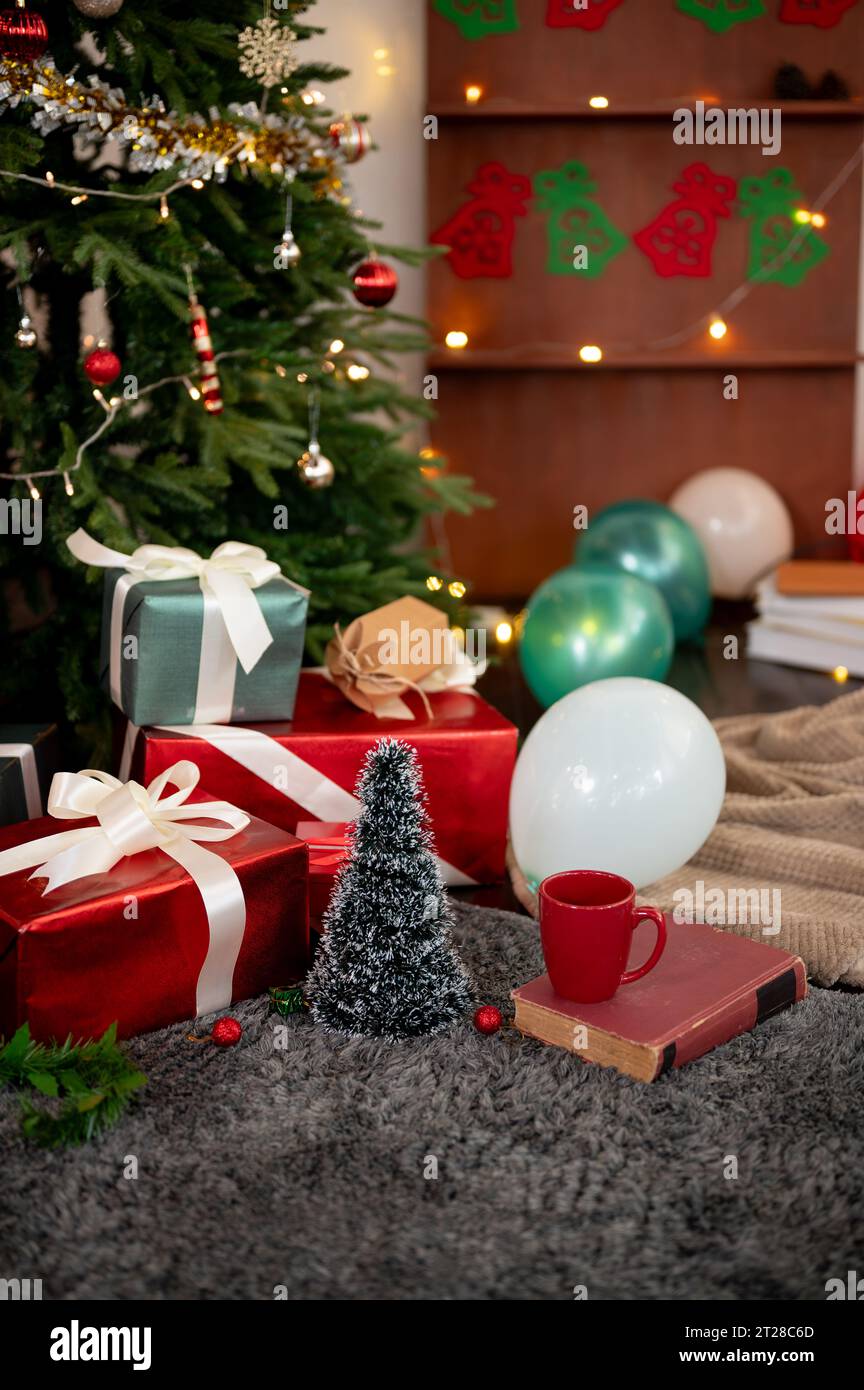 Set of Christmas present boxes under the Christmas tree in a cosy ...