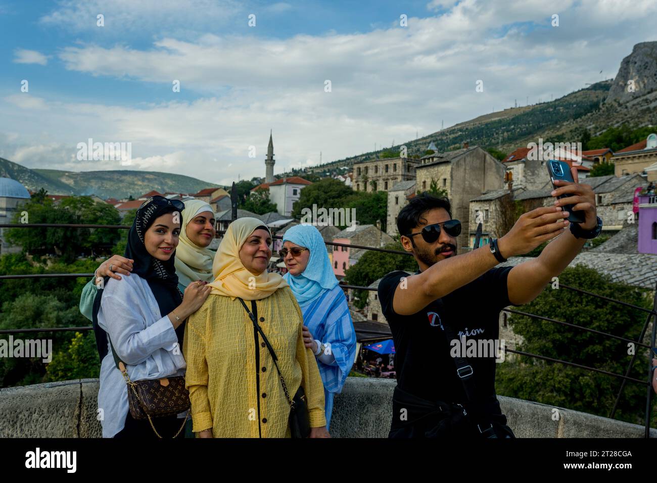 A Muslim family is taking selfies on the Stari Most Bridge (UNESCO ...