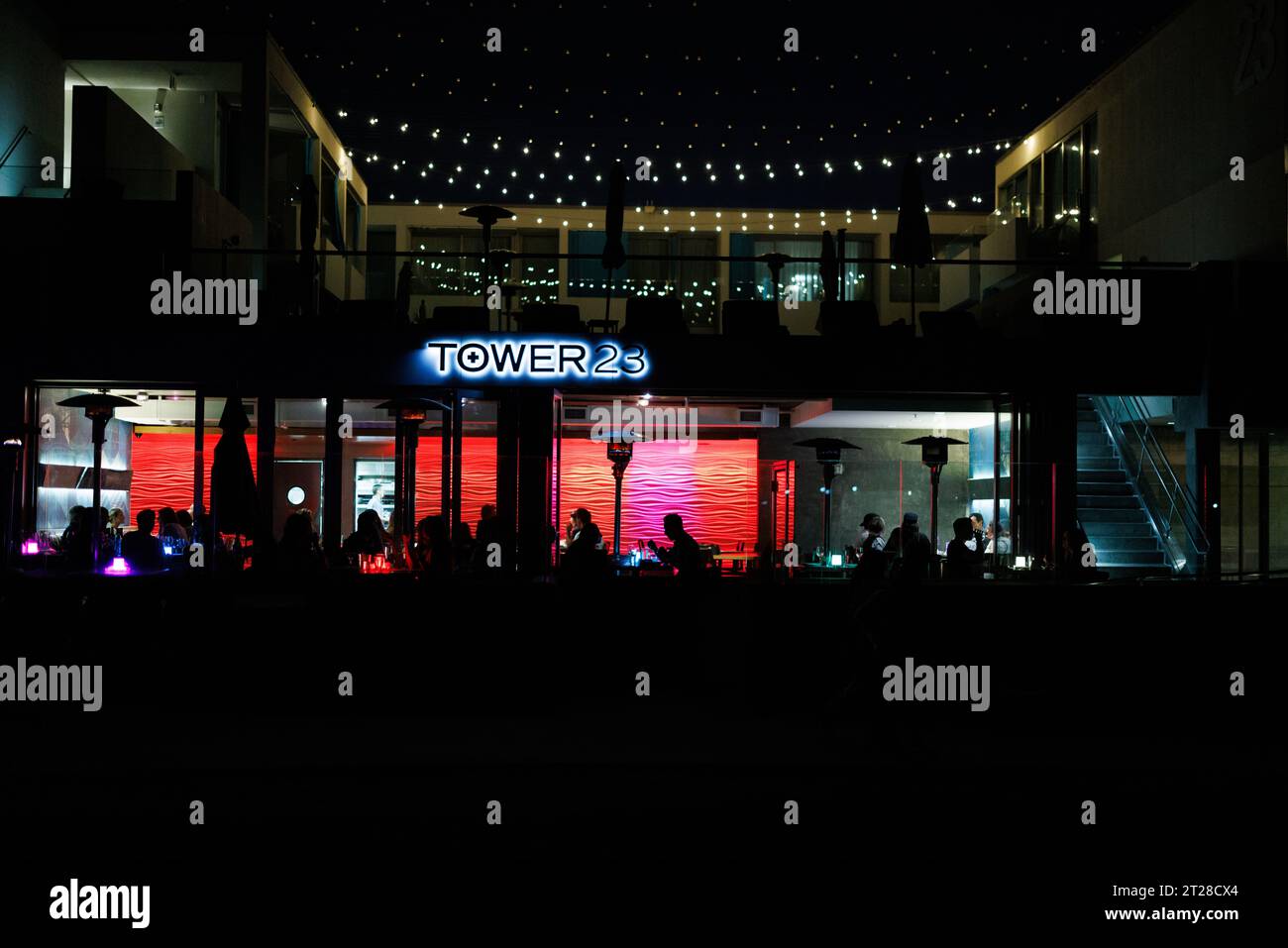 modern beach bar at night with people Stock Photo - Alamy