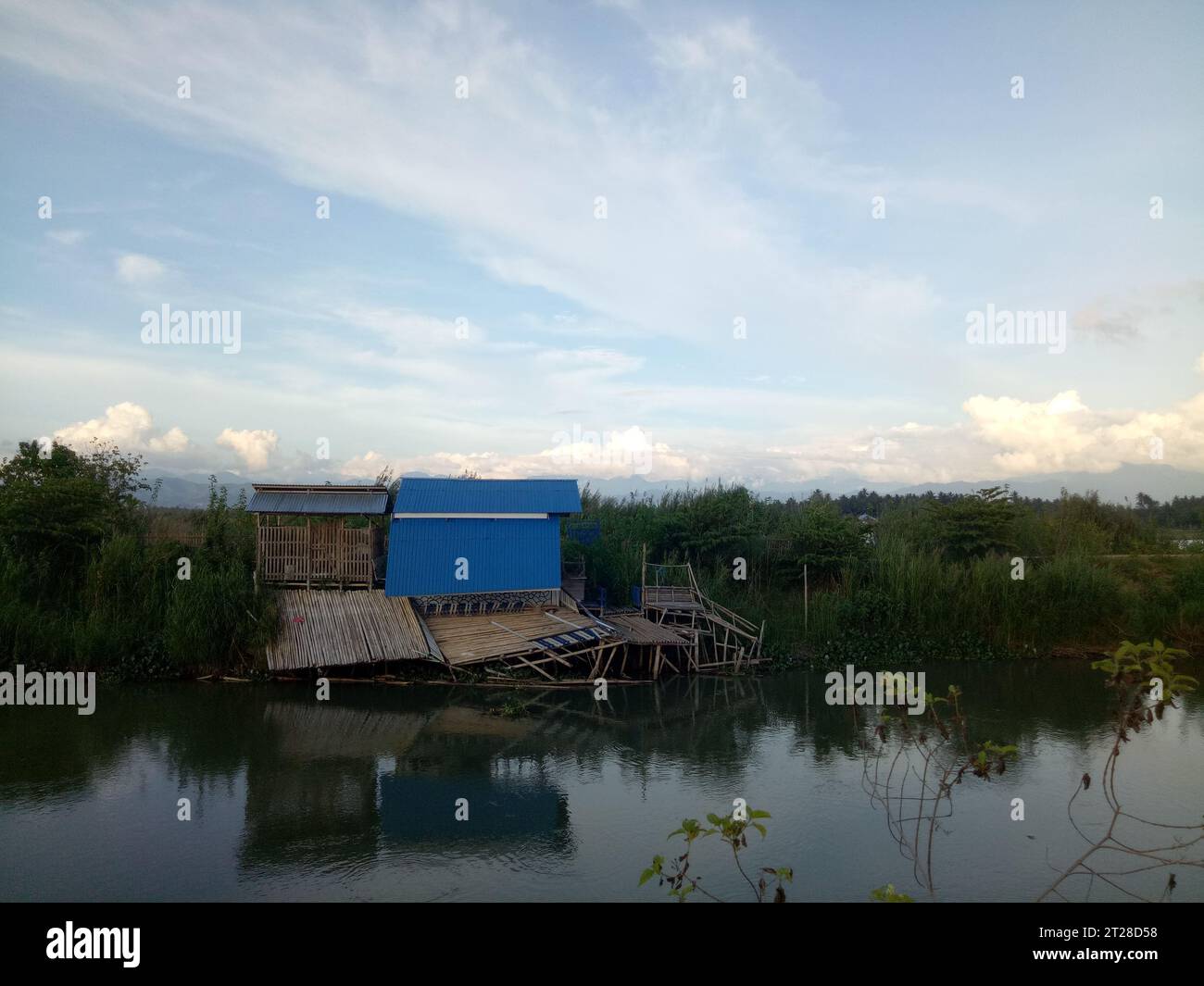 broken hut by the river Stock Photo - Alamy