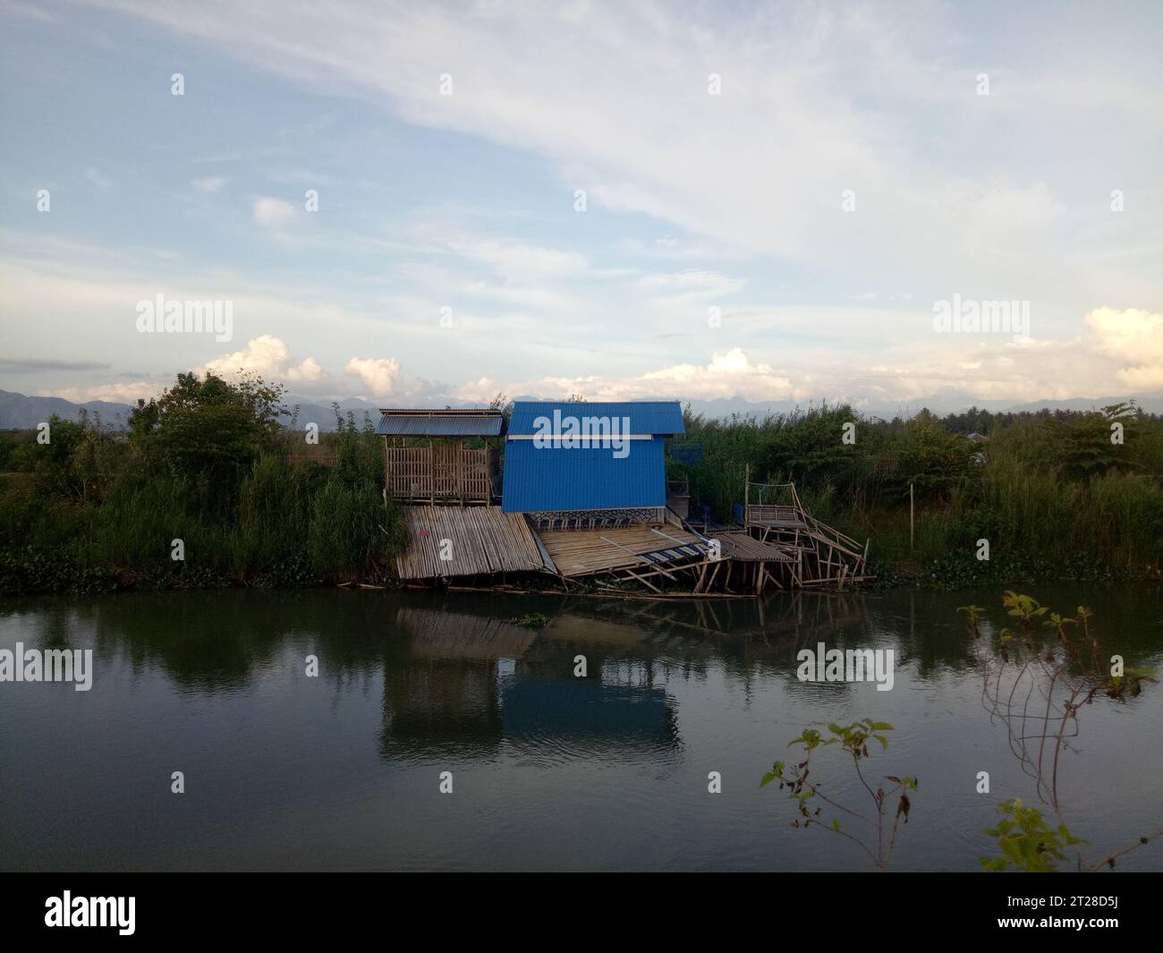 broken hut by the river Stock Photo - Alamy