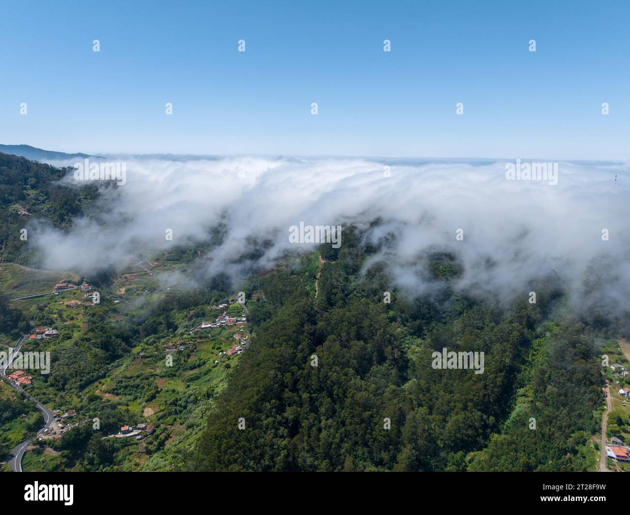 Aerial view of the clouds coming in over Santa da Serrra in Madeira ...