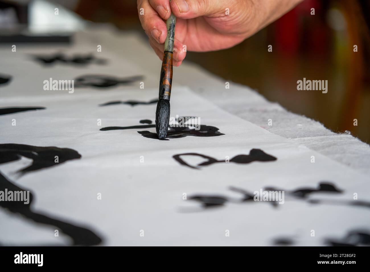 A Chinese calligrapher writes calligraphy and creates a calligraphy ...