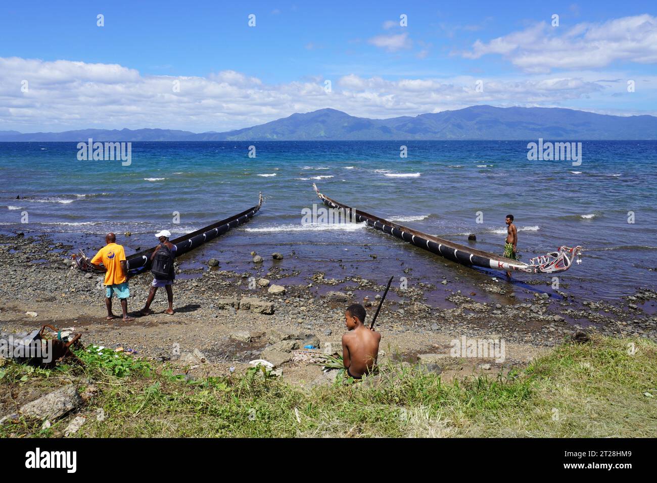Two War Canoes on Display on the Coast of Alotau, Papua New Guinea ...