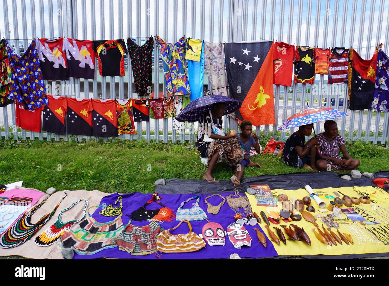Traders with their Souvenirs spread out on the Ground outside the Gates ...
