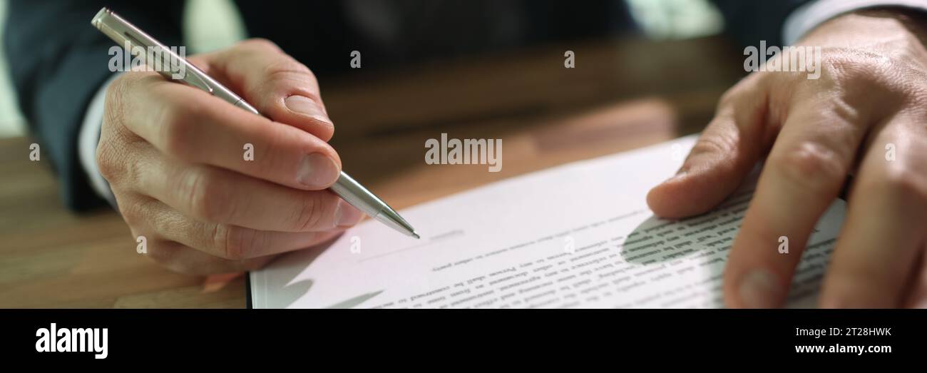 Businessman puts personal signature on contract paper sheet Stock Photo ...