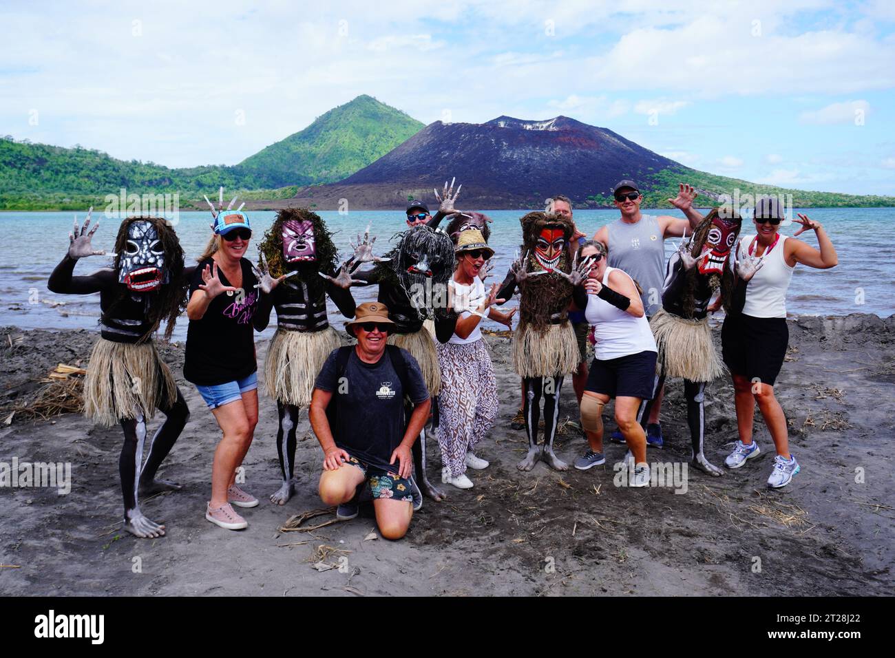 Masked Dancers in Rabaul posing with Spectators in Front of Mount ...