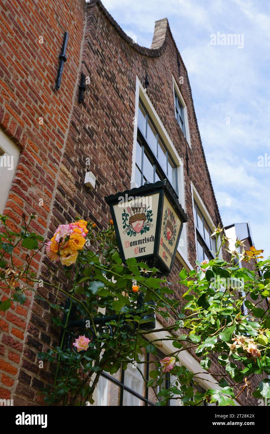 Looking up at typical traditional Dutch old fashioned gable roof brick ...