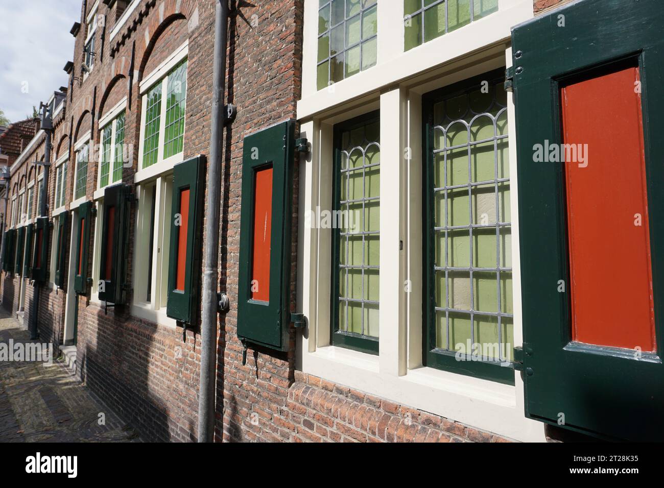 A row of typical traditional Dutch old fashioned brick houses with ... A row of typical traditional Dutch old fashioned brick houses with ...