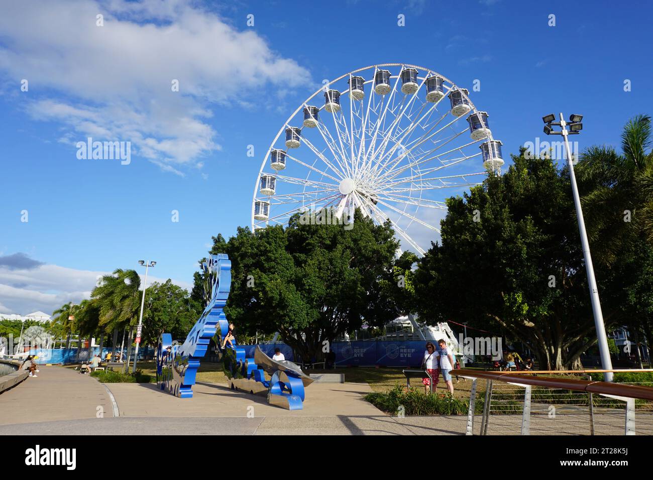 Cairns Esplanade with ferris wheel the Reef Eye and sculpture Citizens ...