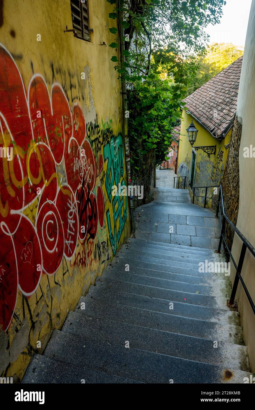 An alley scene with colorful graffiti in the old town of Zagreb ...