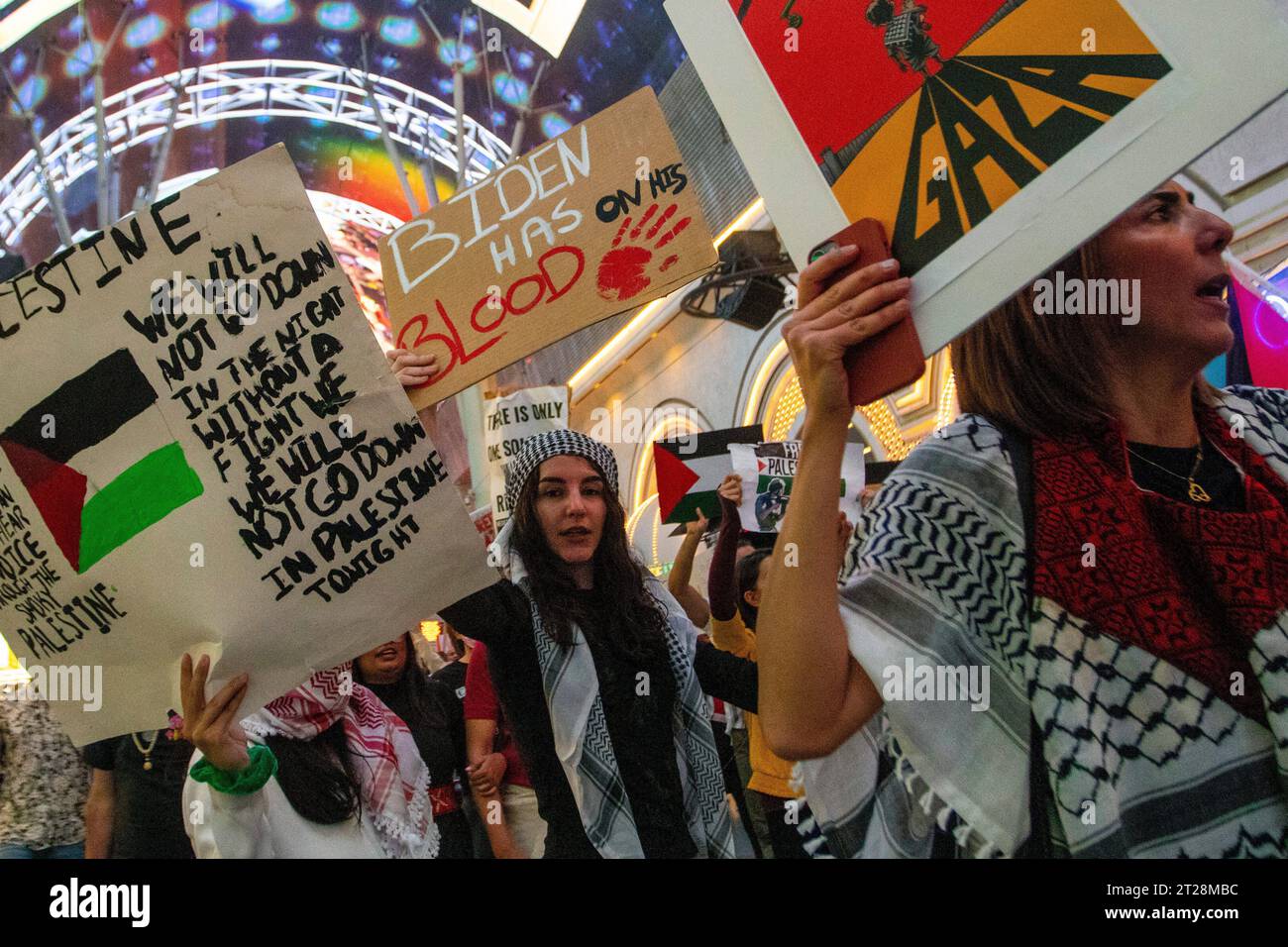 Pro-Palestinian protesters march through Fremont street on Tuesday, Oct ...