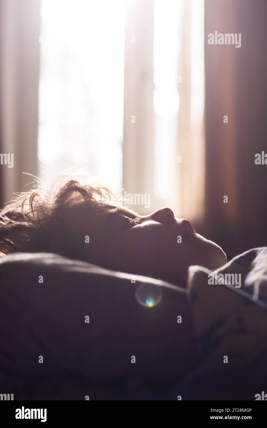 Cute child boy sleeping in the bed. Kid boy napping Stock Photo - Alamy
