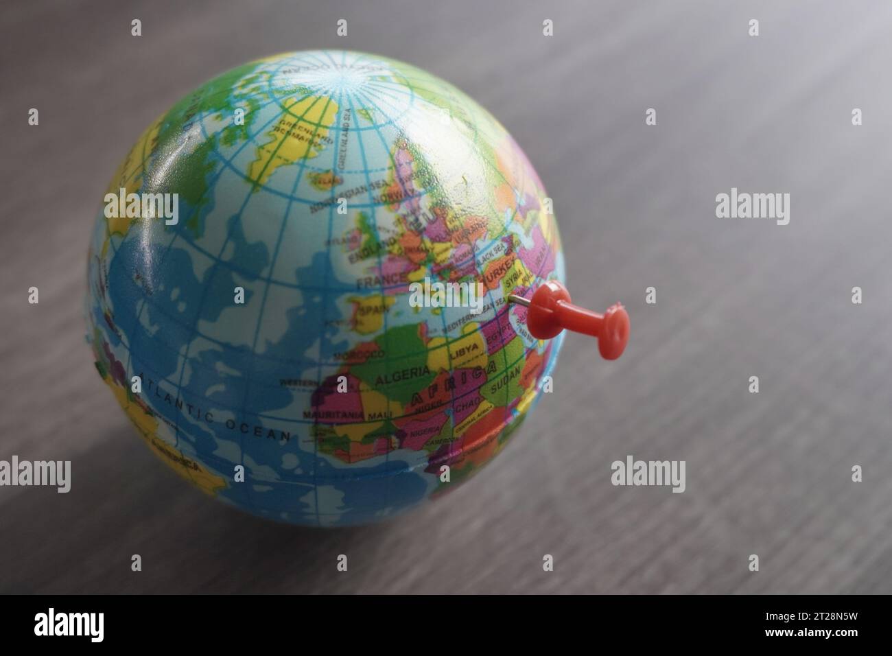 Close up image of push pin pointing at Gaza, Palestine on world globe ...