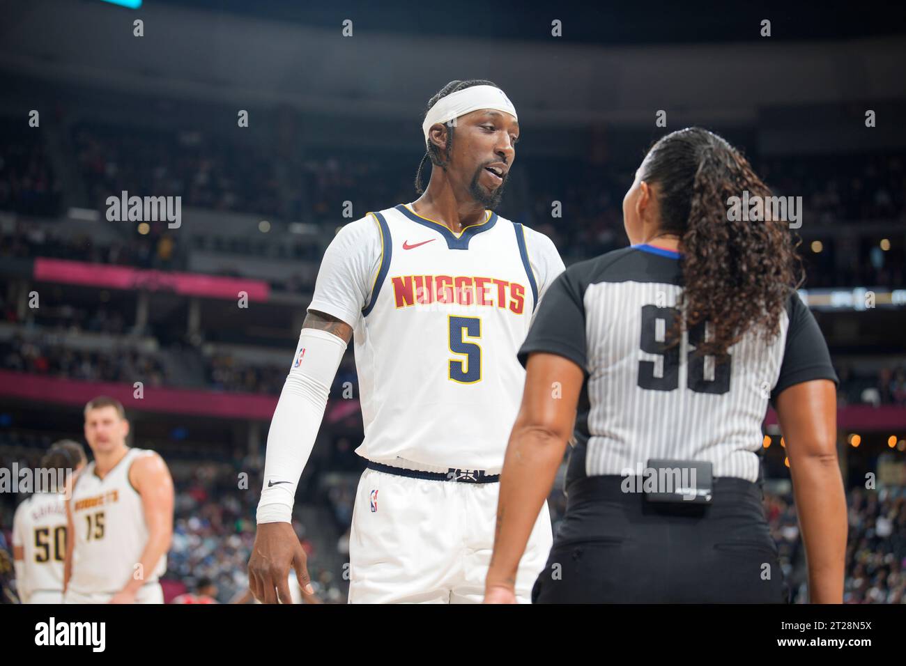 Denver Nuggets guard Kentavious Caldwell-Pope (5) confers with referee ...