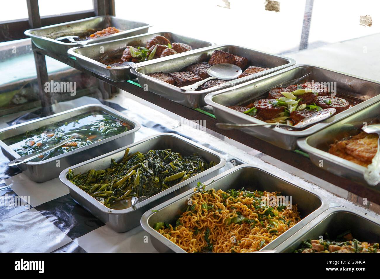 Food stalls share a variety of buffet menus with vegetables, chicken ...