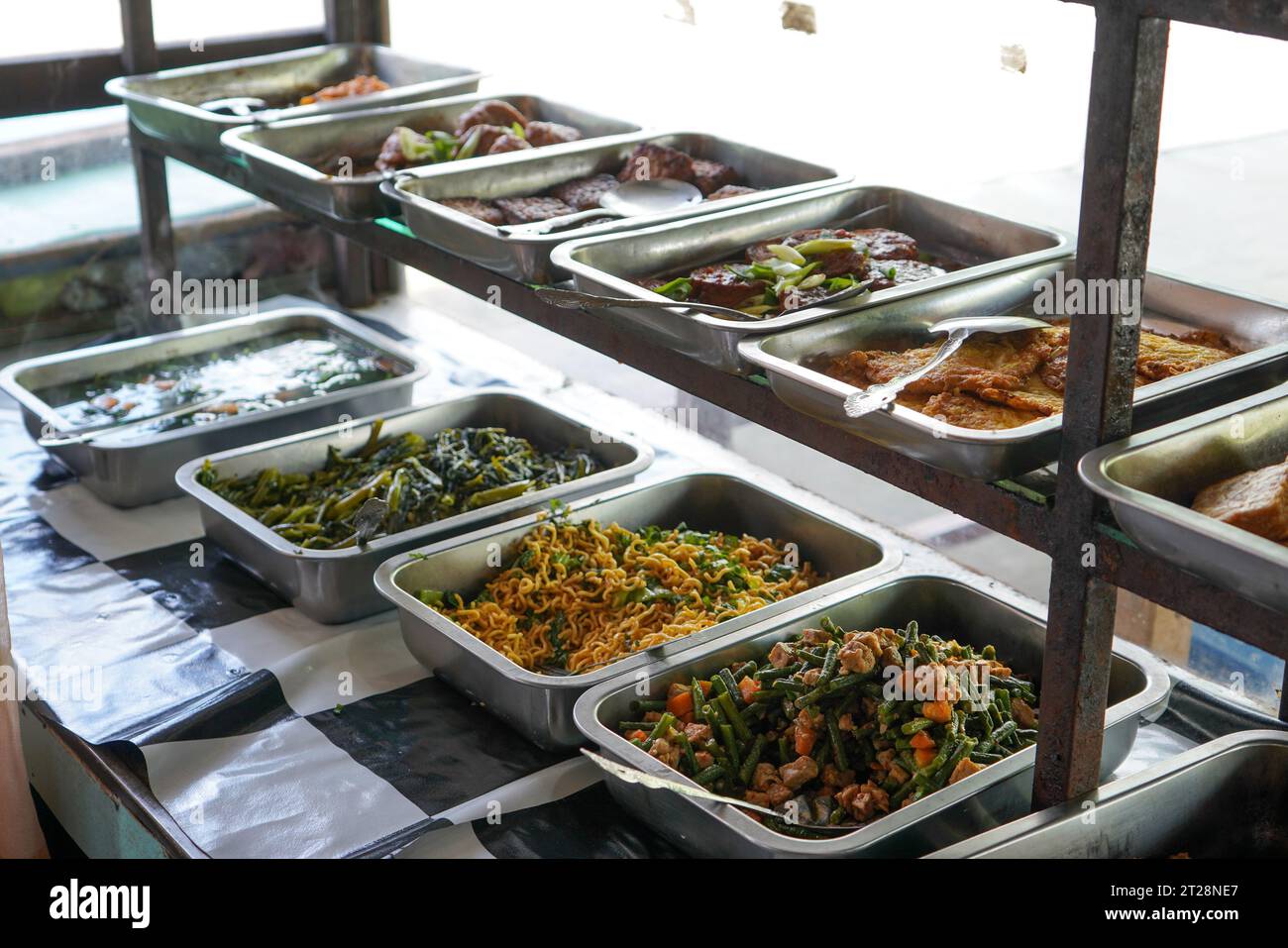 Food stalls share a variety of buffet menus with vegetables, chicken ...
