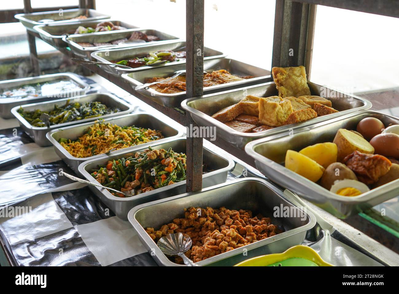 Food stalls share a variety of buffet menus with vegetables, chicken ...
