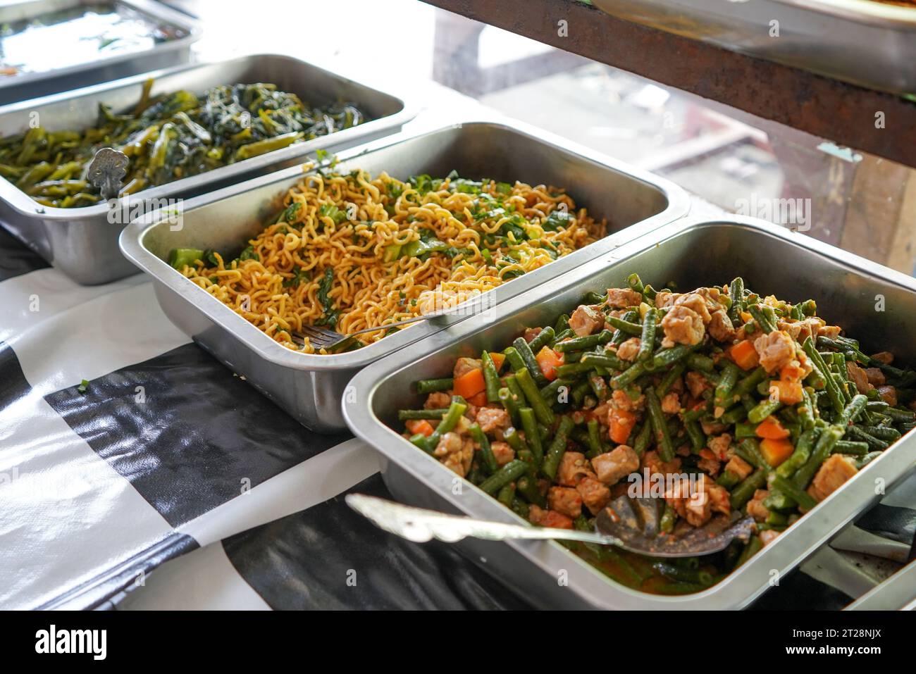 Food stalls share a variety of buffet menus with vegetables, chicken ...