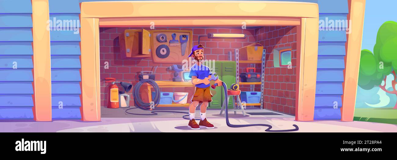 Young man stands at entrance to garage with brick walls, cabinets and ...