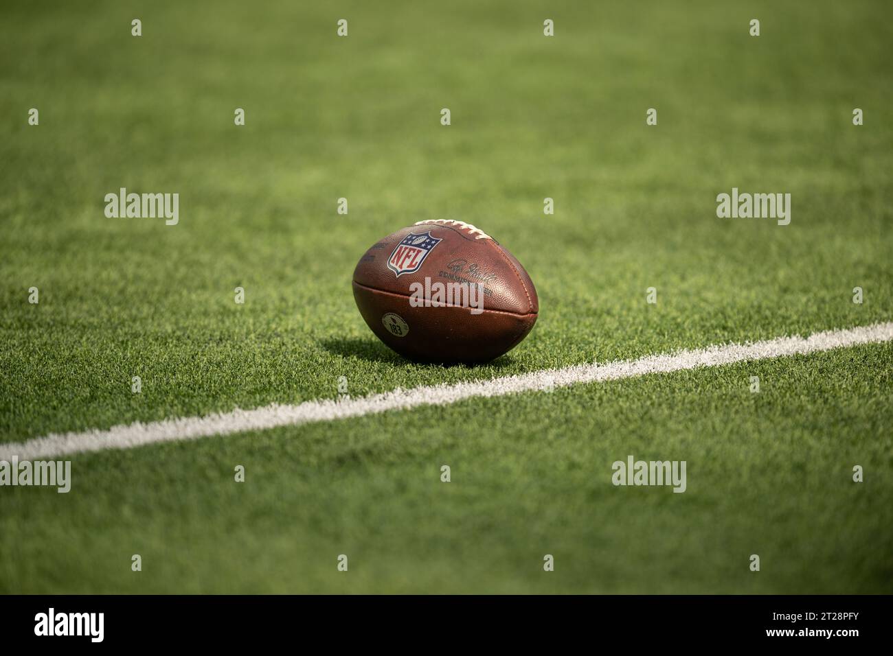 An National Football League ball sits on the field before an NFL ...