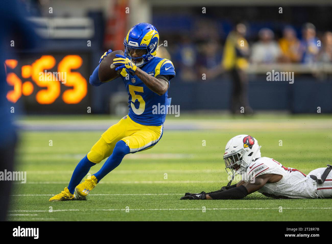 Los Angeles Rams wide receiver Tutu Atwell (5) runs with the ball past ...