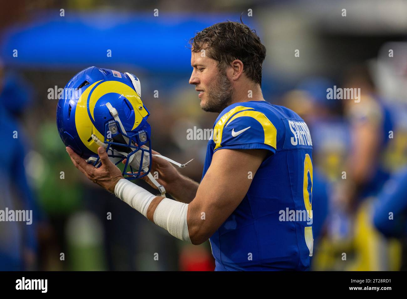 Los Angeles Rams quarterback Matthew Stafford (9) puts his helmet on ...