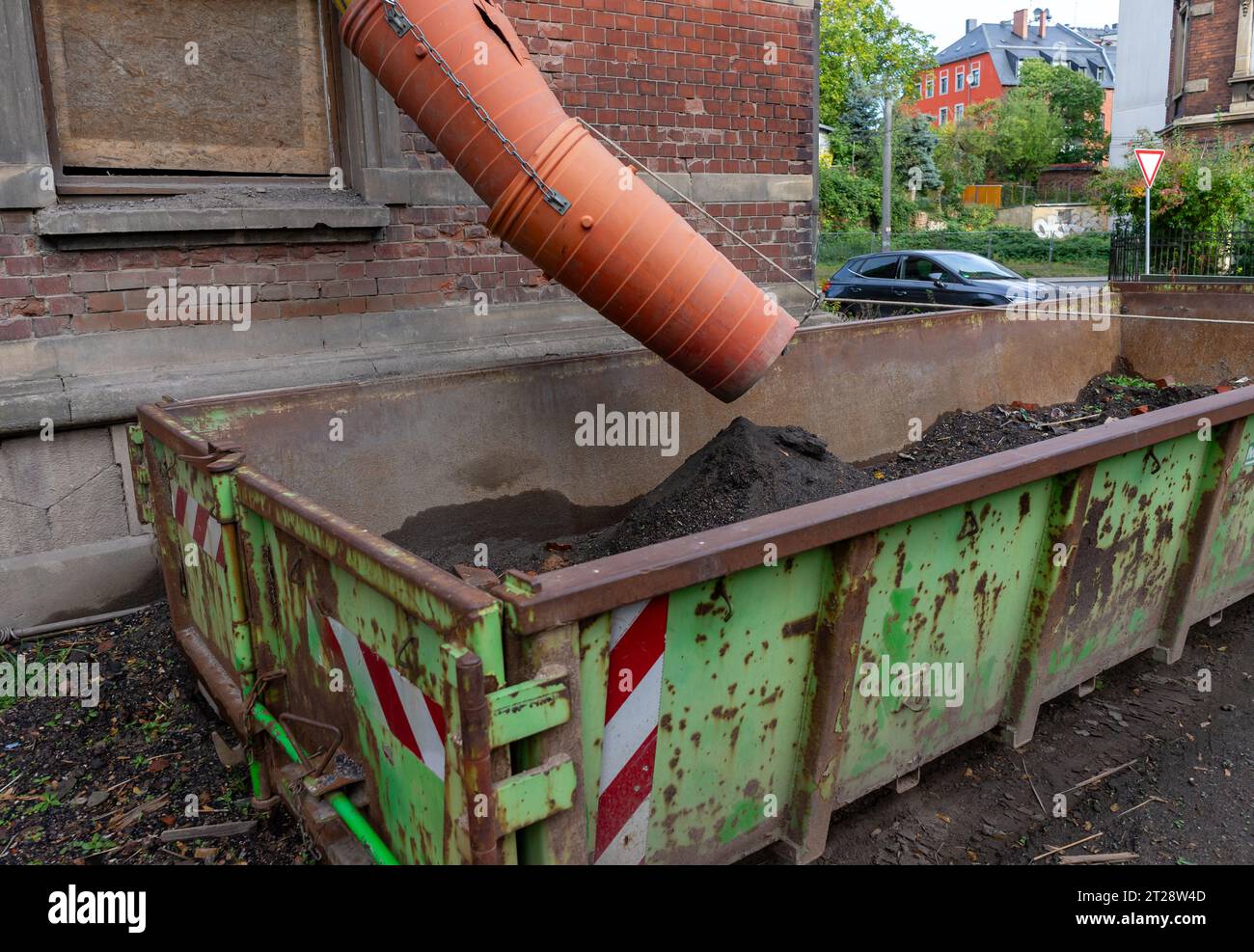 Rubble chute with container on a construction site for construction ...