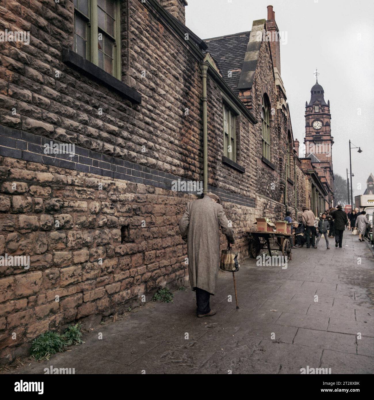 Old man walking along Gedling Street next to Sneinton Market and ...