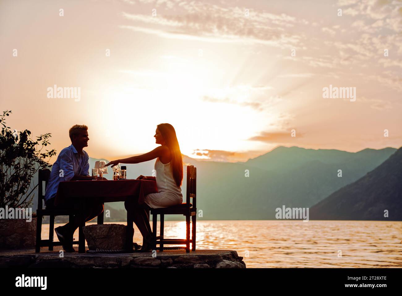 People, vacation, love and romance concept. Young couple enjoying a ...