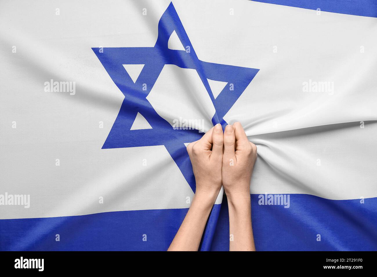 Female hands on flag of Israel Stock Photo - Alamy