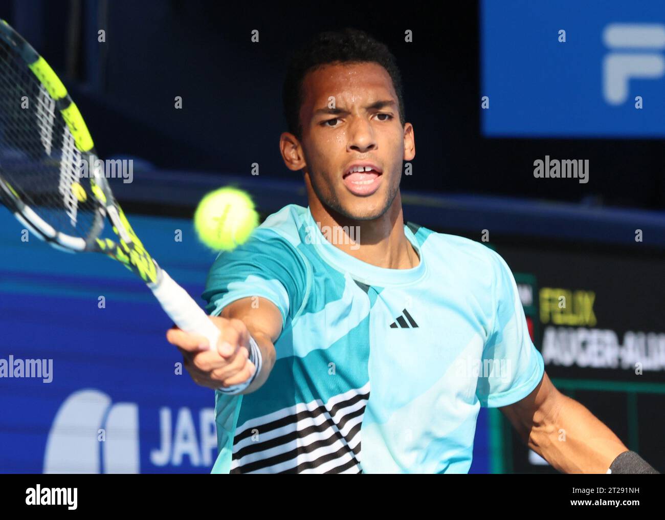 Tokyo, Japan. 18th Oct, 2023. Felix Auger-Aliassime of Canada returns the ball against Sebastian ...