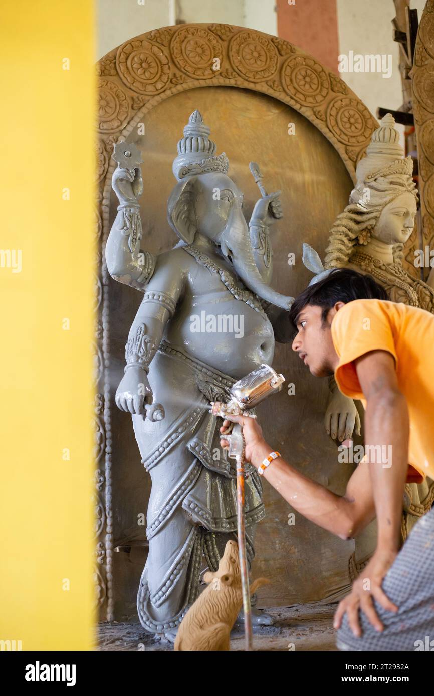 Birbhum, West Bengal, India - October 14th 2023: An artist is painting ...