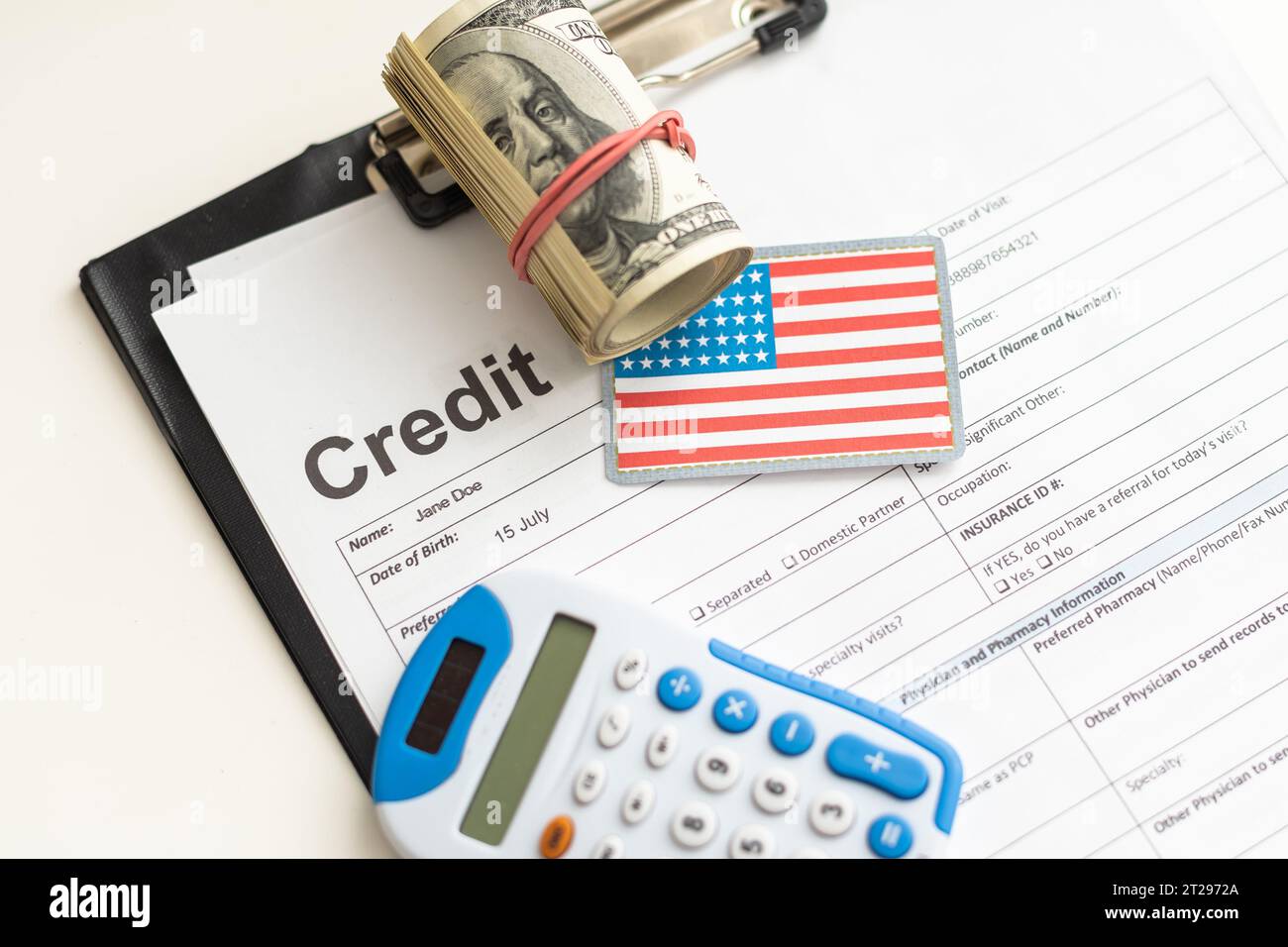 US Federal Income 1040 tax return form with money and flag Stock Photo ...