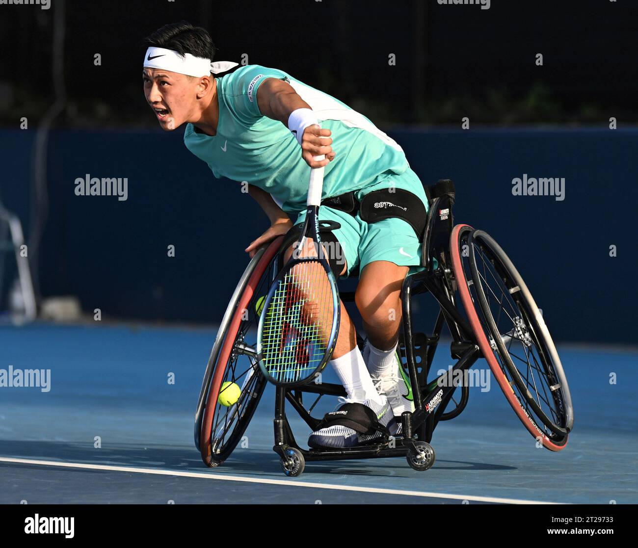 Japanese wheelchair tennis champion Tokito Oda returns a ball to his ...