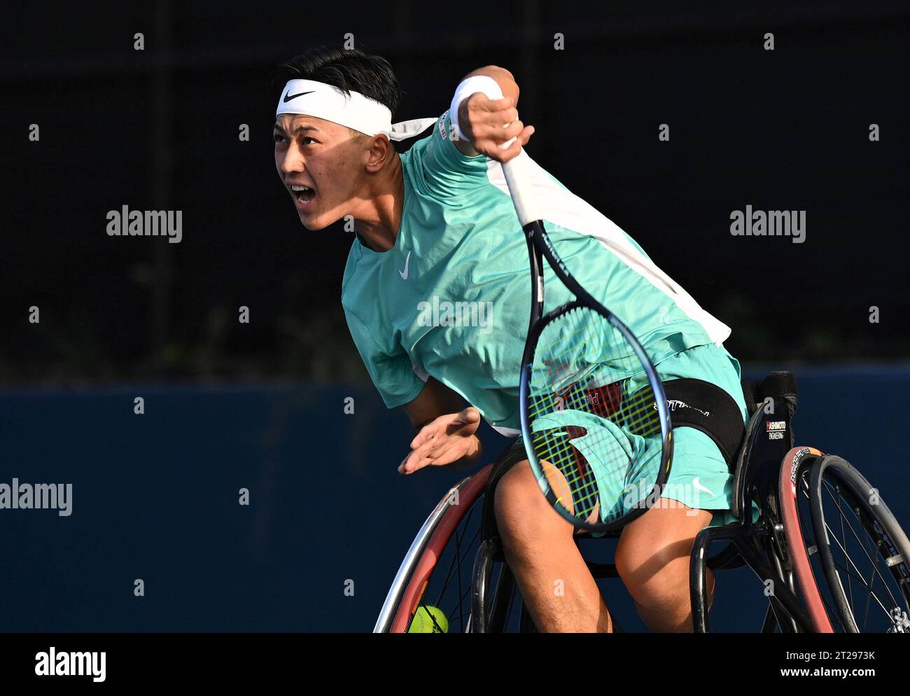 Japanese wheelchair tennis champion Tokito Oda returns a ball to his ...