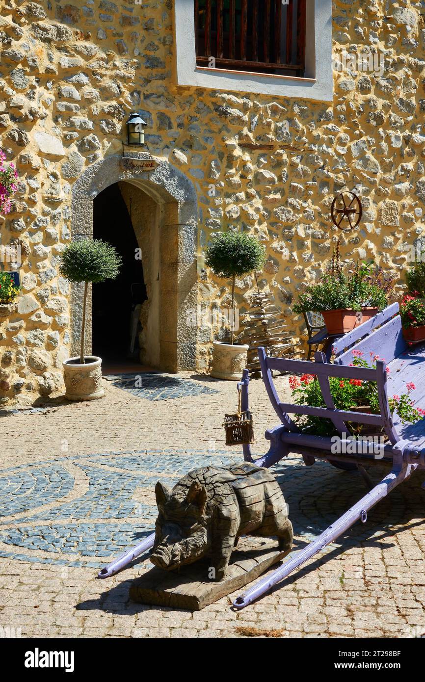 Old blue, french hay cart with hanging baskets of flowers in Castellane ...