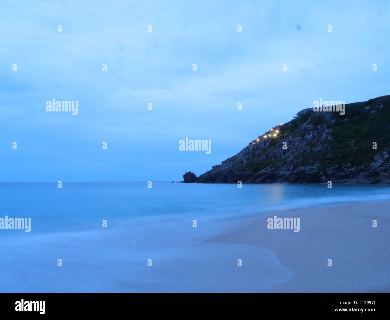 Lighted Minack theater, cliffs and beach in the evening in Porthcurno ...