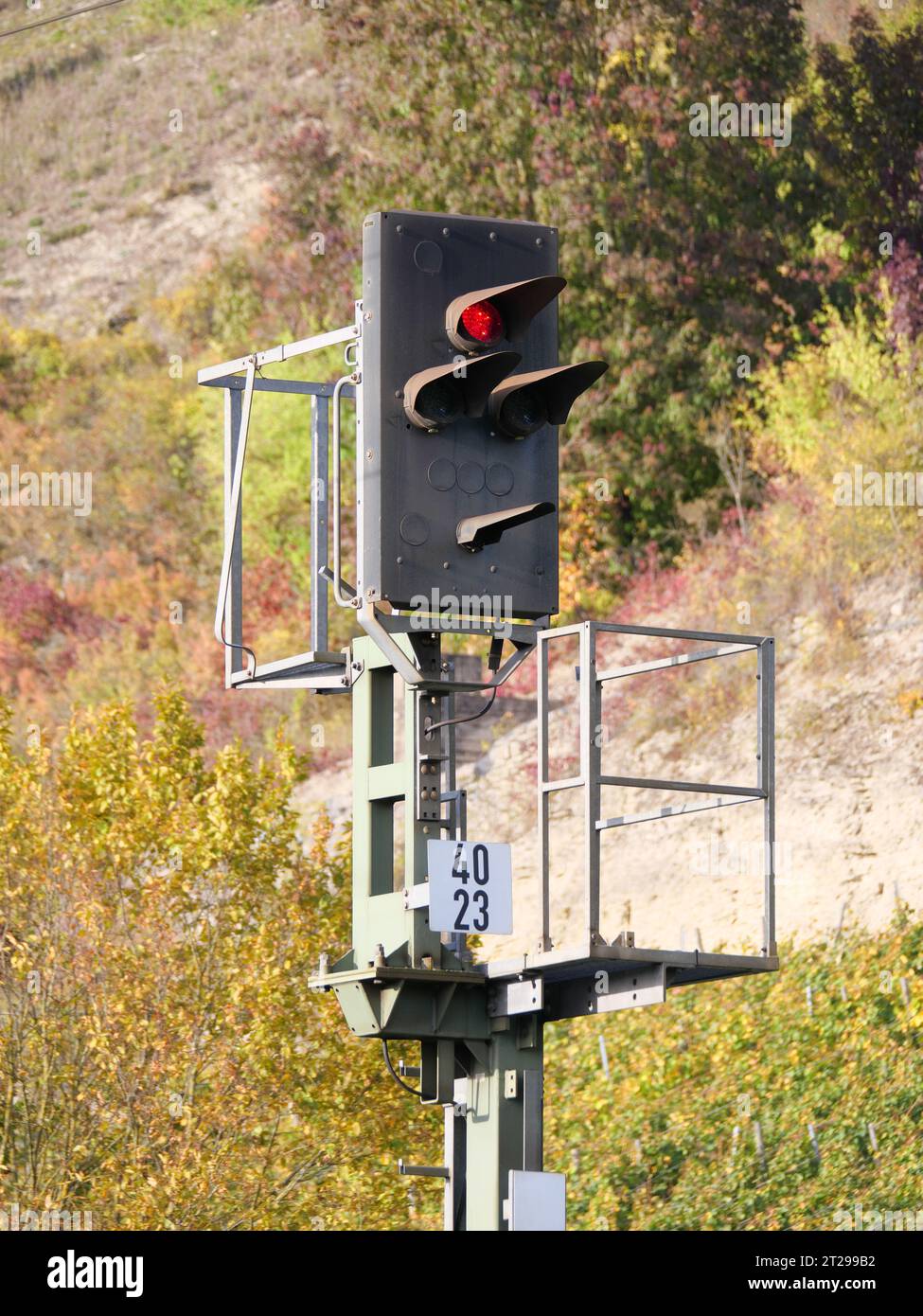 A railroad signal as a railroad traffic light stands on red Stock Photo ...